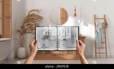 Hands holding notepad with creative bathroom design blueprint sketch or ...