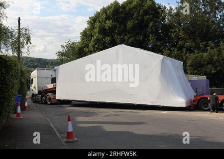 Lorry transporting prefabricated house module to building site ...
