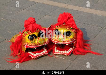 lion dance props on the gray ground Stock Photo - Alamy