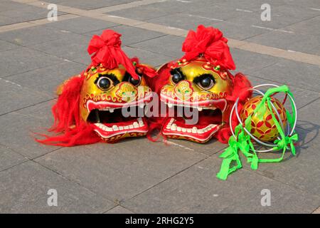 lion dance props on the gray ground Stock Photo - Alamy