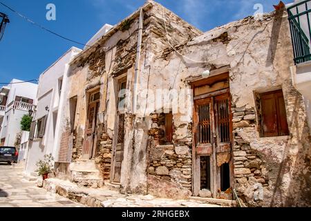 Old weather-worn Greek buildings-cracked walls and peeling paint, decay ...
