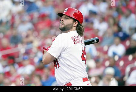 St. Louis Cardinals' Alec Burleson, right, examines a ball as teammate ...