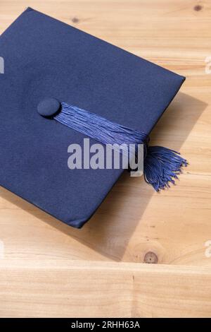 A traditional mortar board cap worn at University graduation ceremonies ...