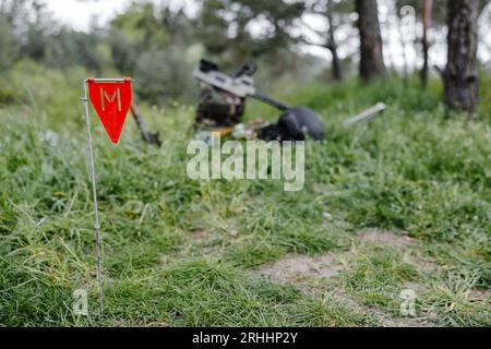 Explosive devices and a metal detector lie on the background of a ...
