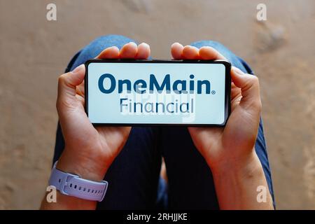 In this photo illustration, the OneMain Financial logo seen displayed ...