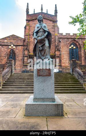 Bronze sculpture of Lady Wulfrun stands at the top of a stone staircase ...