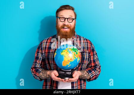 Photo of young man student globus look thoughtful decide which country ...