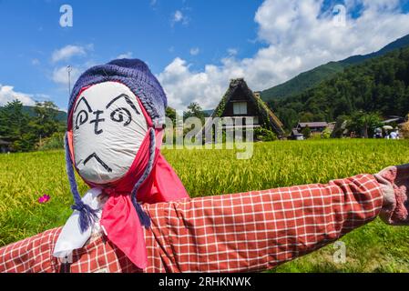 Scarecrows in front of traditional Gassho-Zukuri thatched wooden ...
