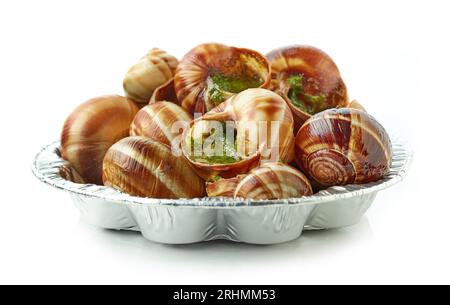 escargot snail filled with garlic and parsley butter in wooden bowl ...