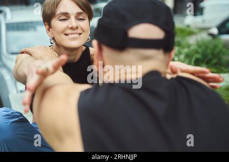 Young guys sit opposite each other Stock Photo - Alamy