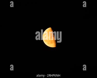 half yellow moon black sky night photography Stock Photo - Alamy
