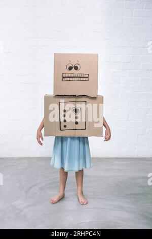 Girl dressed as cardboard monster Stock Photo - Alamy