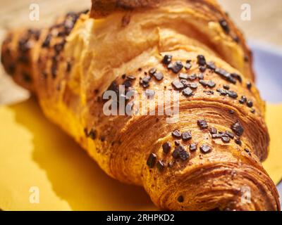 A chocolate croissant, sometimes called a cornetto in Italy Stock Photo ...