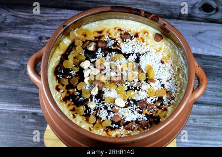 Rice pudding pottery casserole over baked burnt in the oven, rice, corn ...
