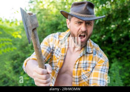 rancher with axe outdoor, copy space. photo of rancher with axe ...