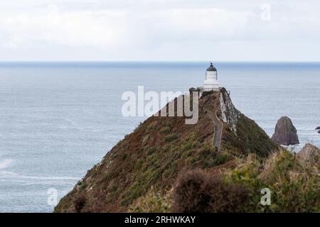 Nugget Point lighthouse and famous rocky islets (The Nuggets) at ...