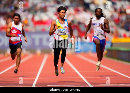 Muhd Azeem Fahmi, of Malaysia, center, crosses the line to win a Men's ...