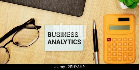 Business graphs paper and calculator on table Stock Photo - Alamy