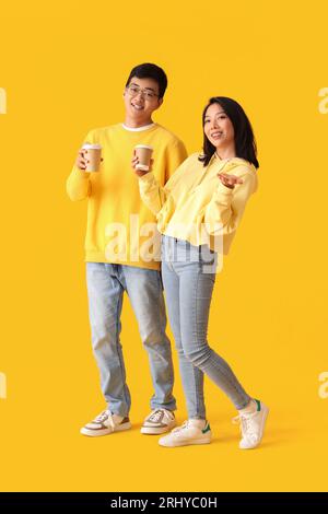 Takeaway cups for coffee on color background Stock Photo - Alamy