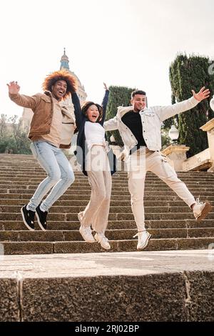 happy teenage students or friends jumping outdoors Stock Photo - Alamy