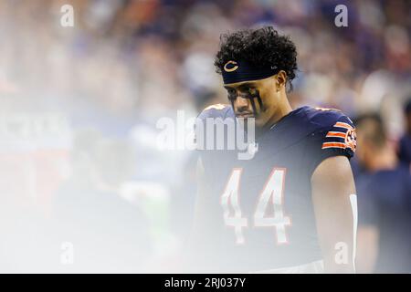 Chicago Bears linebacker Noah Sewell, middle, is helped off the field ...