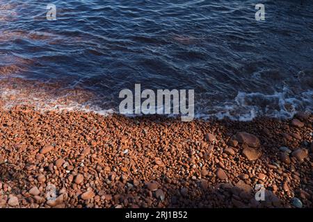 French Riviera beach with red pebbles, travel content Stock Photo - Alamy