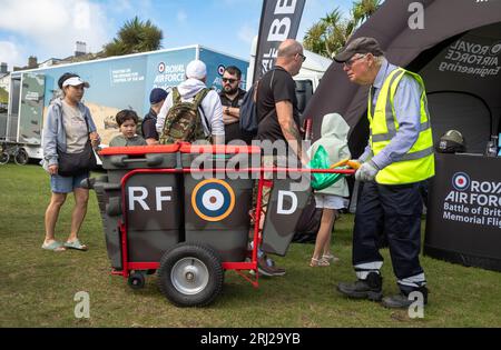 An elderly municipal bin man with his bins painted in the military ...