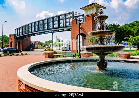 The pedestrian bridge and water fountain are pictured at John B. Foley ...