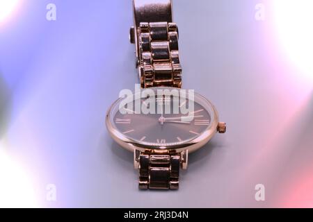 A dark copper toned watch Stock Photo - Alamy