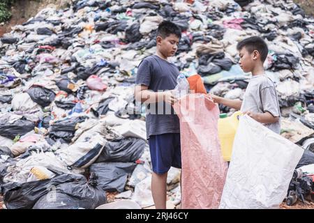 Poor children collect garbage for sale because of poverty, Junk recycle ...