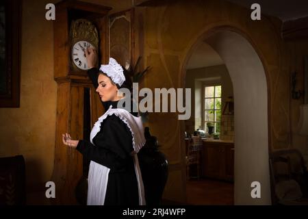 Scenes of a beautiful young Victorian maid doing house chores in an ...