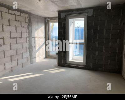 Room with unfinished walls and a room after repair. Before and after ...