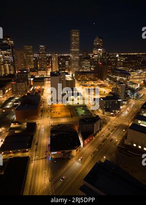 An Aerial shot of Denver at night, with illuminated cityscapes and ...