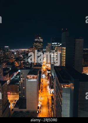 An Aerial shot of Denver at night, with illuminated cityscapes and ...
