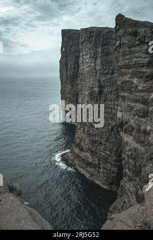 Steep cliffs of Faroe Islands. Vertical cliffs. Massive rocky cliffs ...