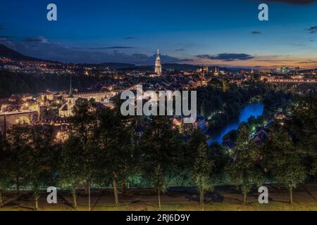 A scenic night aerial view of Bern's old town seen from Rose Garden ...