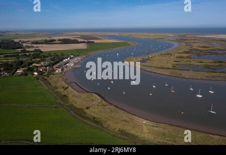 View along coast with Quay at Orford and river Alde ,Suffolk, England ...