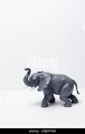 an elephant plastic toy on a white background Stock Photo - Alamy