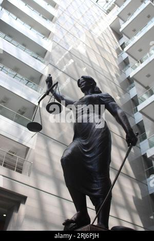 Statue of a female judge representing justice and law inside the ...