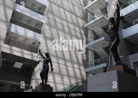Statue of a female judge representing justice and law inside the ...