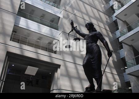 Statue of a female judge representing justice and law inside the ...