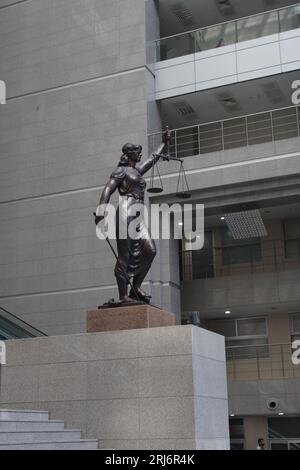 Statue of a female judge representing justice and law inside the ...