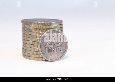 A stack of Armenian dram coins, luma denomination on the white ...