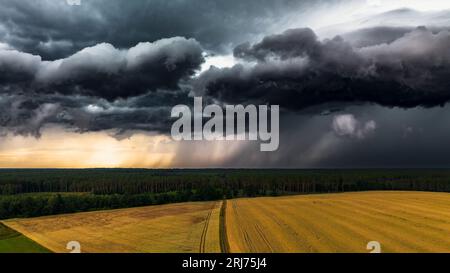 A dramatic view of an incoming storm over a vast expanse of plains ...