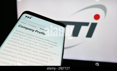 Smartphone with logo of Techtronic Industries Company Limited (TTI) on ...