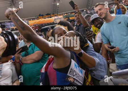 United States' Sha'Carri Richardson takes the baton from teammate Kayla ...