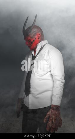 Devilman is standing in the dark background. Scary demon Halloween ...