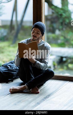Foreign men and women sitting on the veranda Stock Photo - Alamy