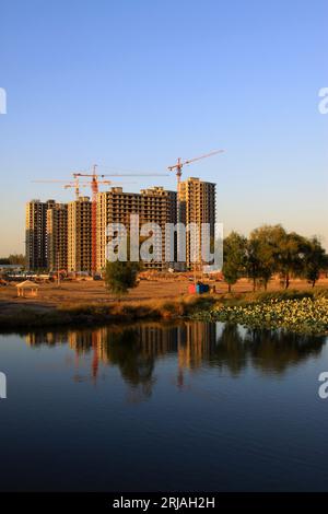 unfinished building at the side of river Stock Photo - Alamy