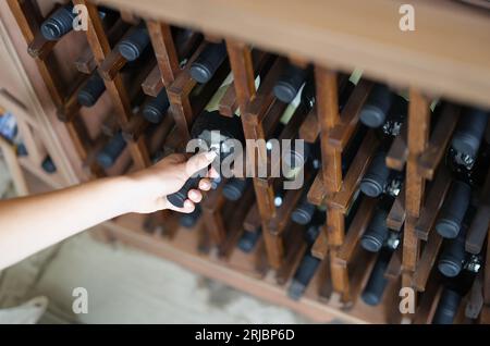 Connoisseur of winemaking chooses elite white wine in cellar Stock ...